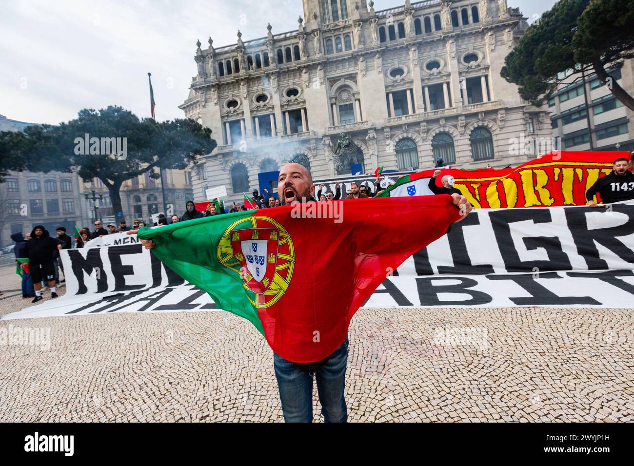 An anti-immigration sympathizer hold a Portugal flag during a far-right ...