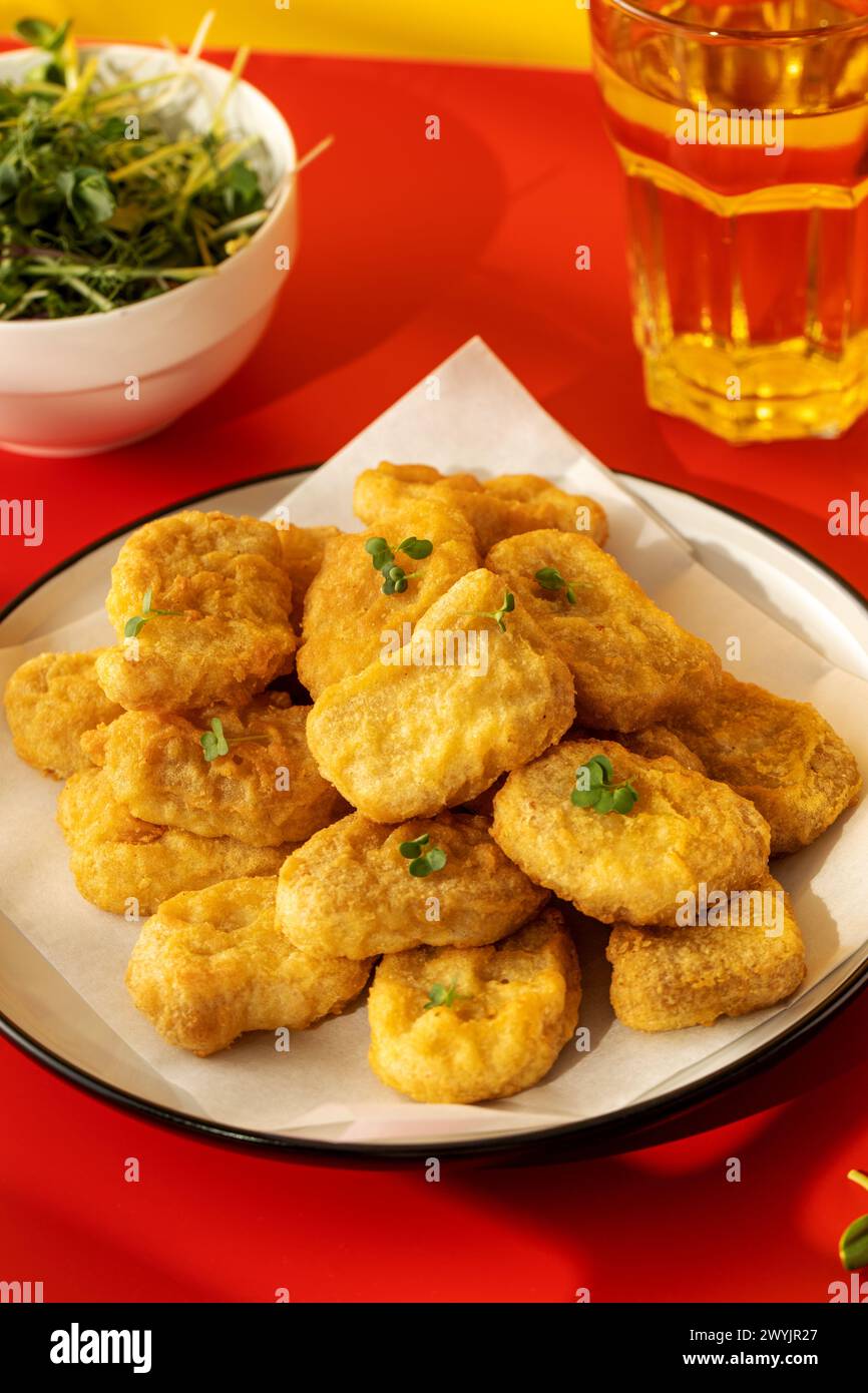 Delicious golden chicken nuggets on a plate close up. Fast food, menu ...
