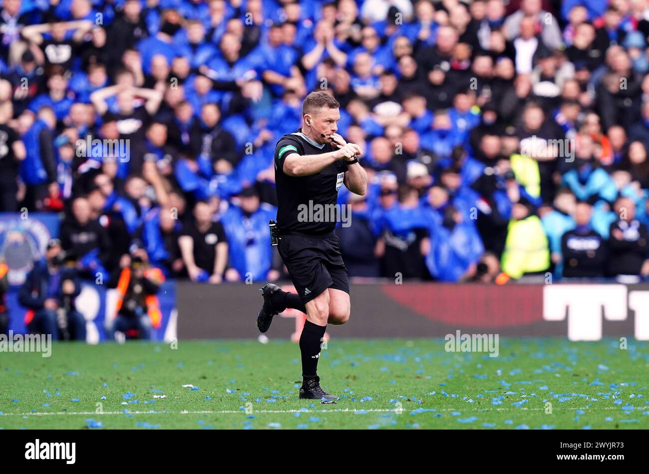Referee John Beaton awards a penalty to Celtic after checking the pitch ...