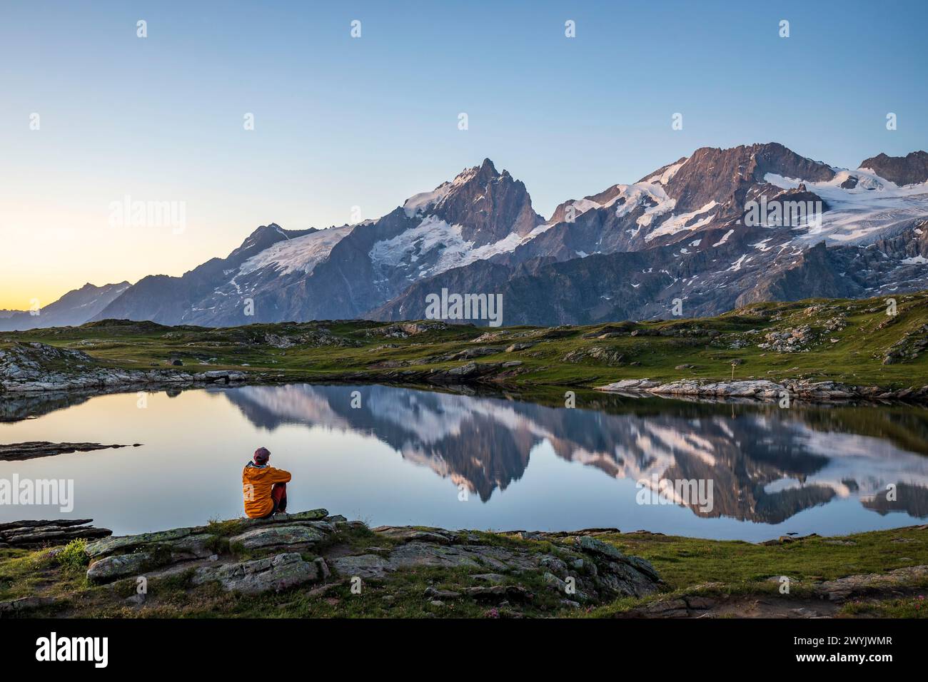 France, Hautes-Alpes, La Grave, Emparis plateau, hiker on the edge of ...