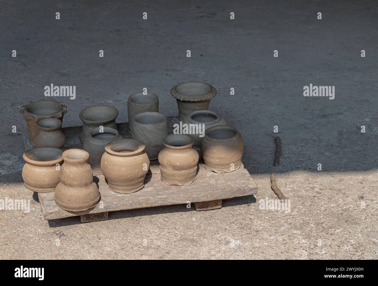 An empty of freshly made clay Pots. Clay pots background handmade art ...