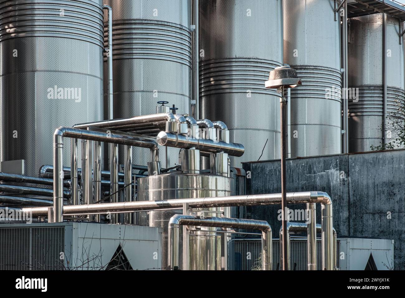 Stainless steel pipes and storage tanks. Industrial wine production ...