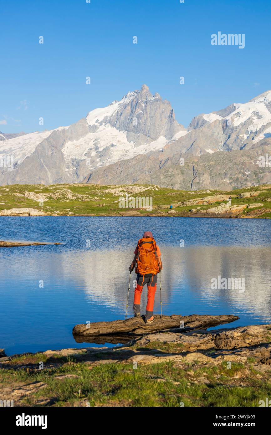 France, Hautes-Alpes, La Grave, Emparis plateau, hiker at the edge of ...