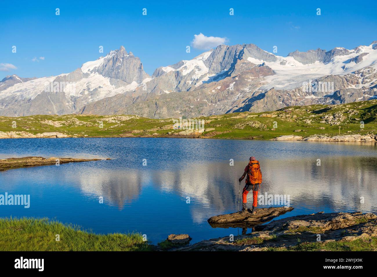 France, Hautes-Alpes, La Grave, Emparis plateau, hiker at the edge of ...