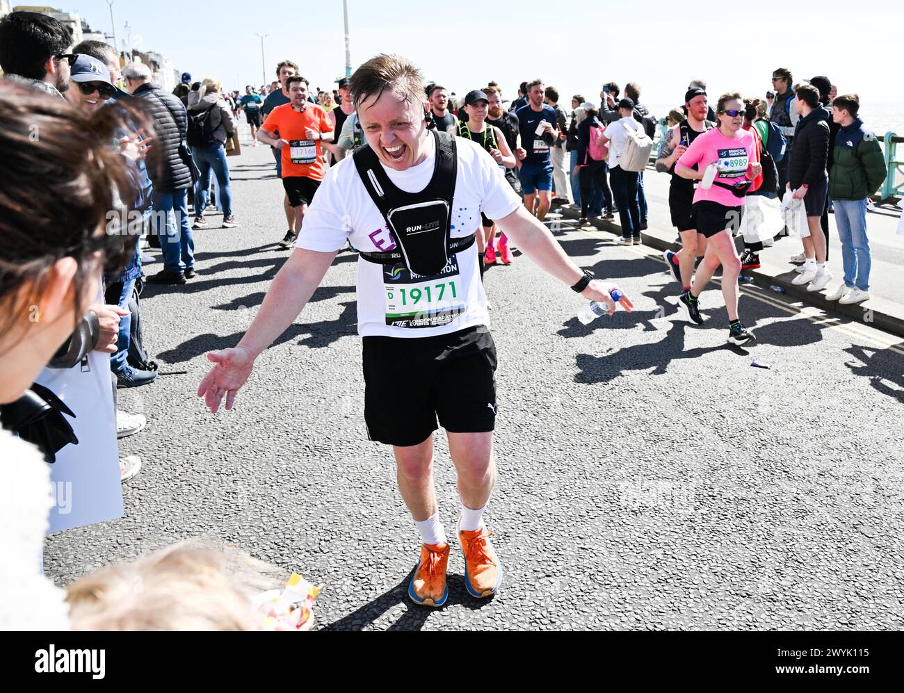 Brighton UK 7th April 2024 - This runner is delighted to see his family ...