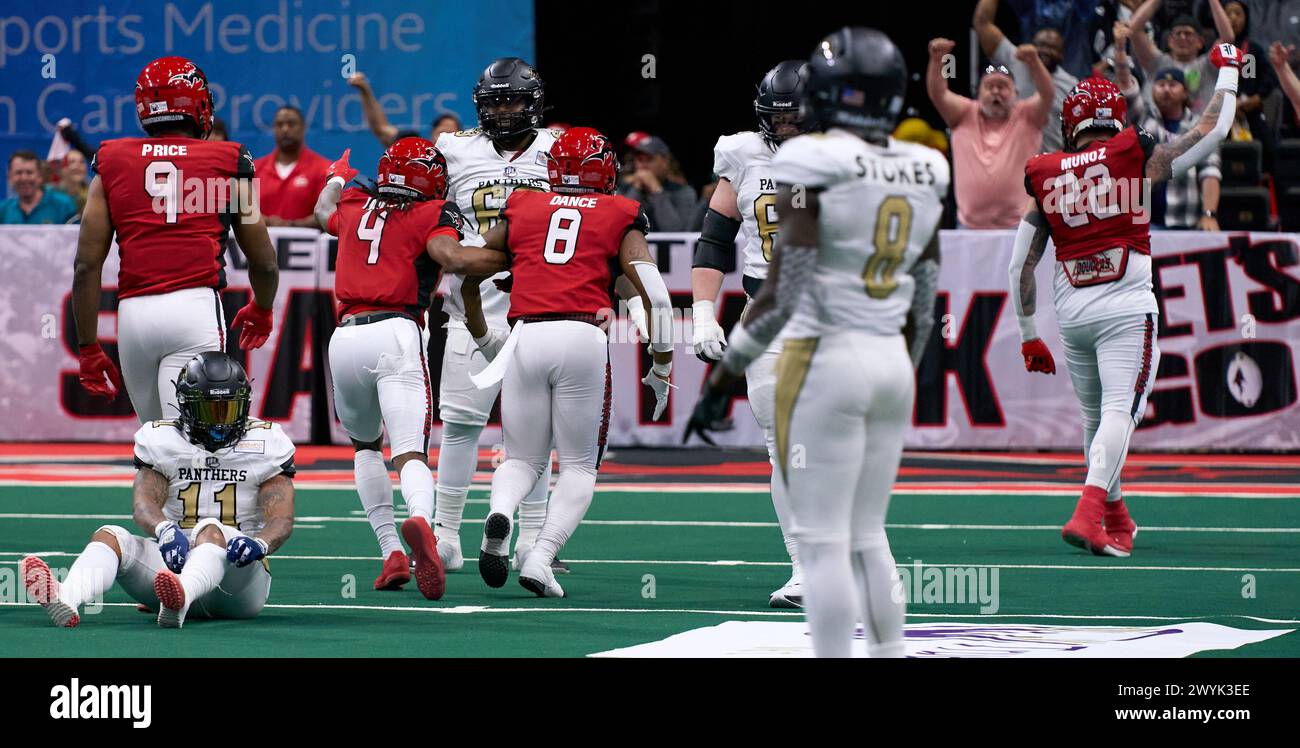 LB Sir Zion Dance (#8) celebrates with teammates DL Jermiah Price (#9 ...