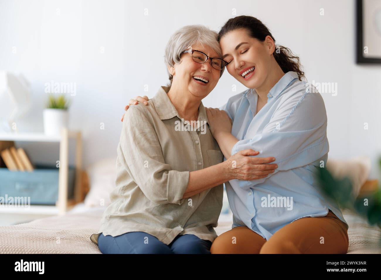 Mother and daughter talking on bed hi-res stock photography and images - Alamy
