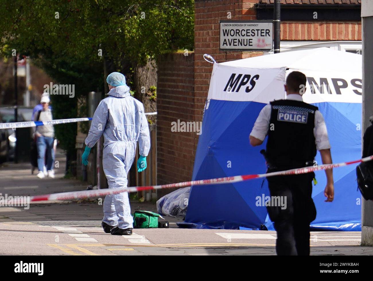 Police and Forensic investigators at the scene on Northumberland Park ...