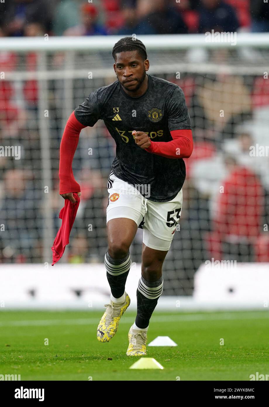 Manchester United's Willy Kambwala warming up before the Premier League ...