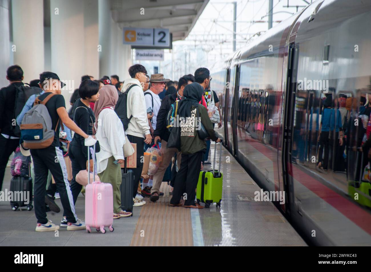 Padalarang, Indonesia. 7th Apr, 2024. Passengers wait to board a high ...