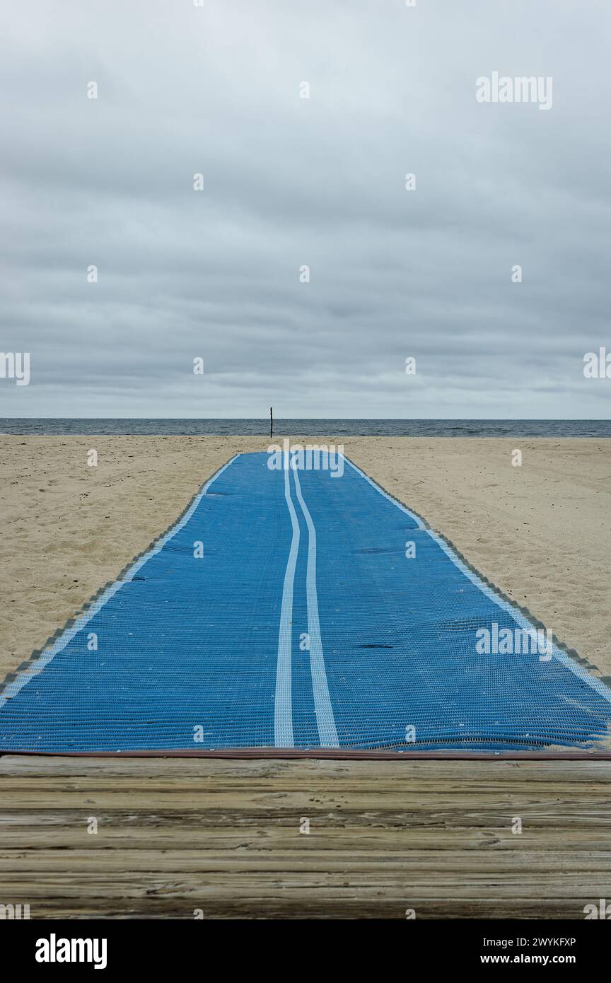 2023 Hampton Beach, New Hampshire. A blue runway mat with white stripes ...