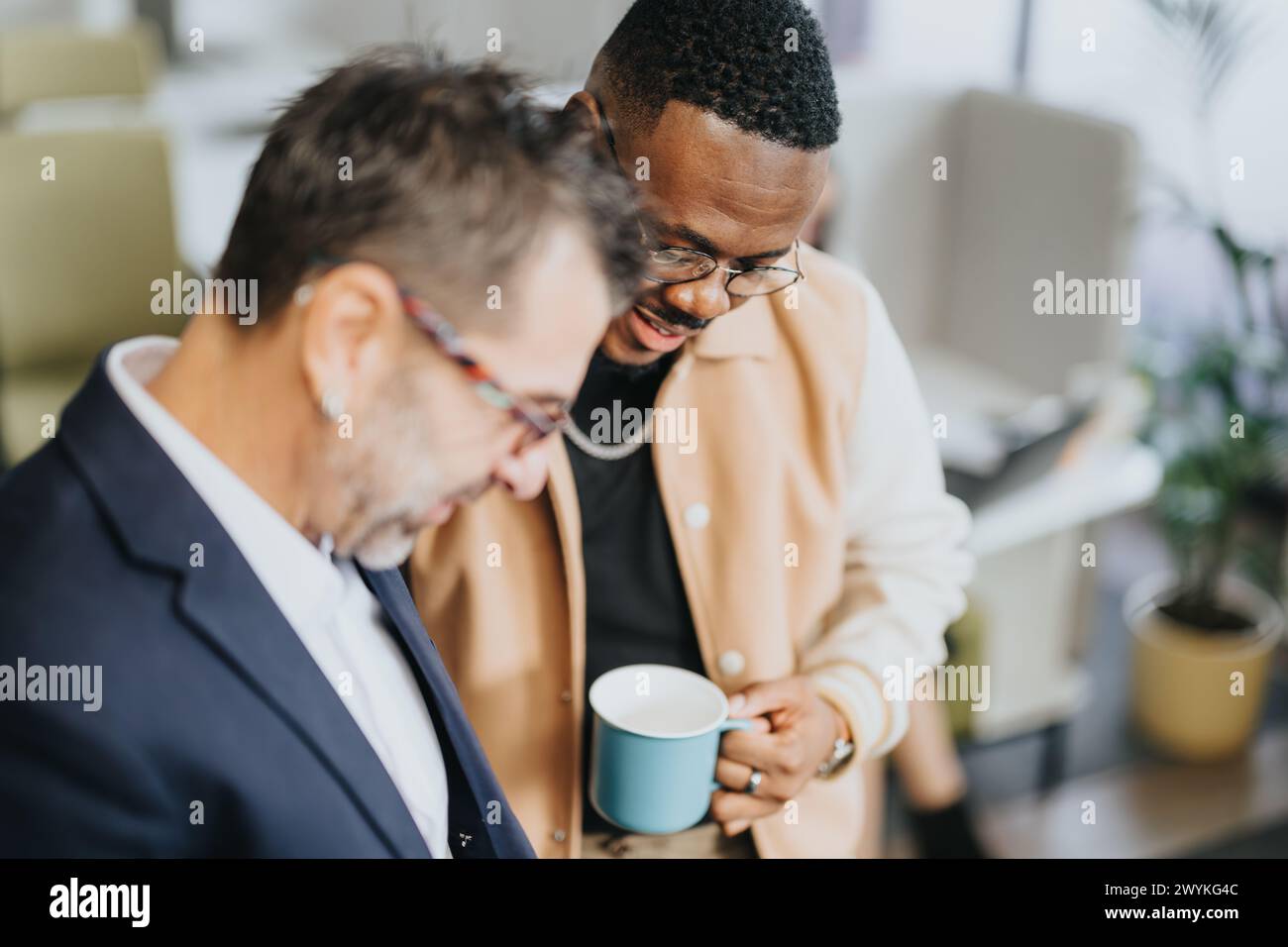 Business colleagues collaborating and sharing ideas for successful ...