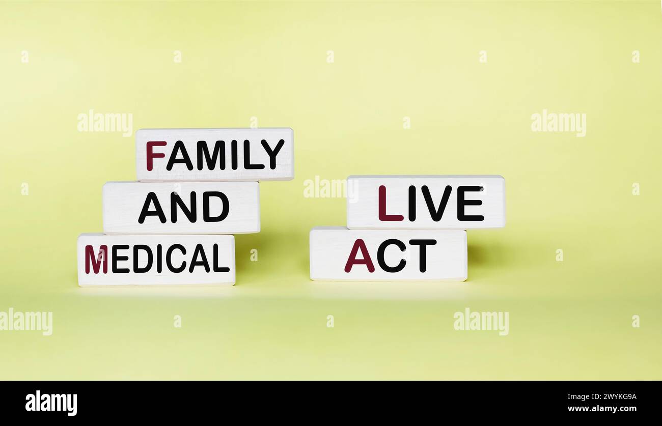 Wooden blocks with FMLA Family and Medical Live Act text on light ...