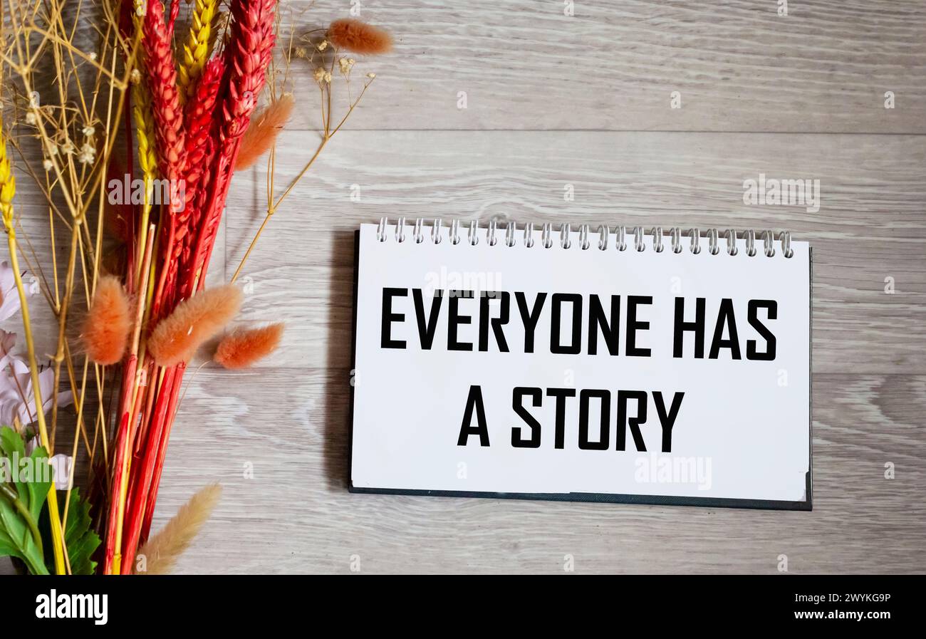 Notepad with the inscription Everyone has their own story with a ...