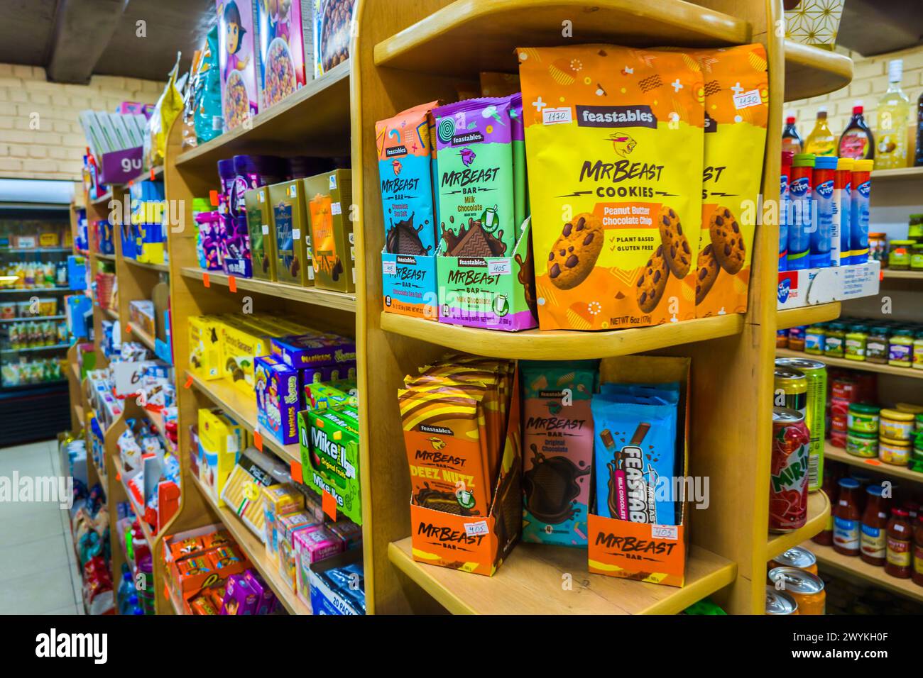 Chocolate bars and cookies by Mr Beast on small store shelf, his ...