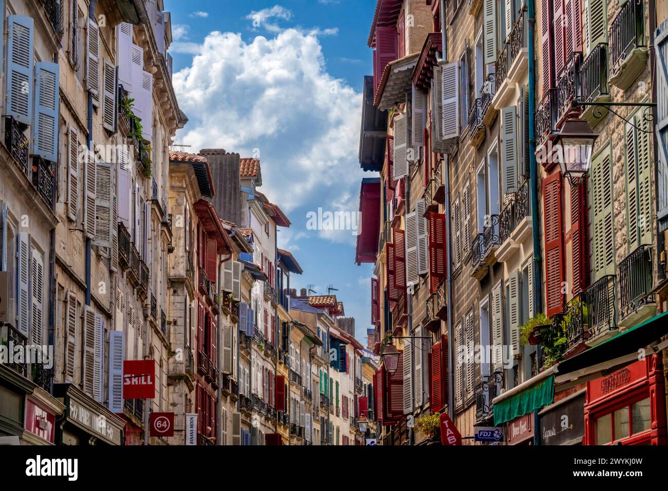Traditional facades with colorful windows in Bayonne, Basque Country ...