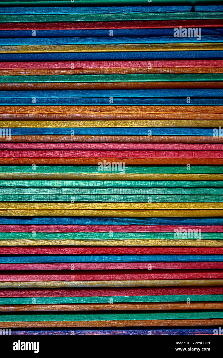 Multi colored wooden craft sticks, colorful background Stock Photo - Alamy