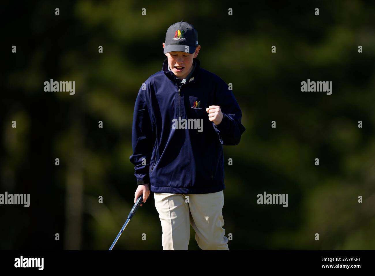 Luke Gladfelter, of Chesapeake Beach, Md., reacts after sinking a putt ...