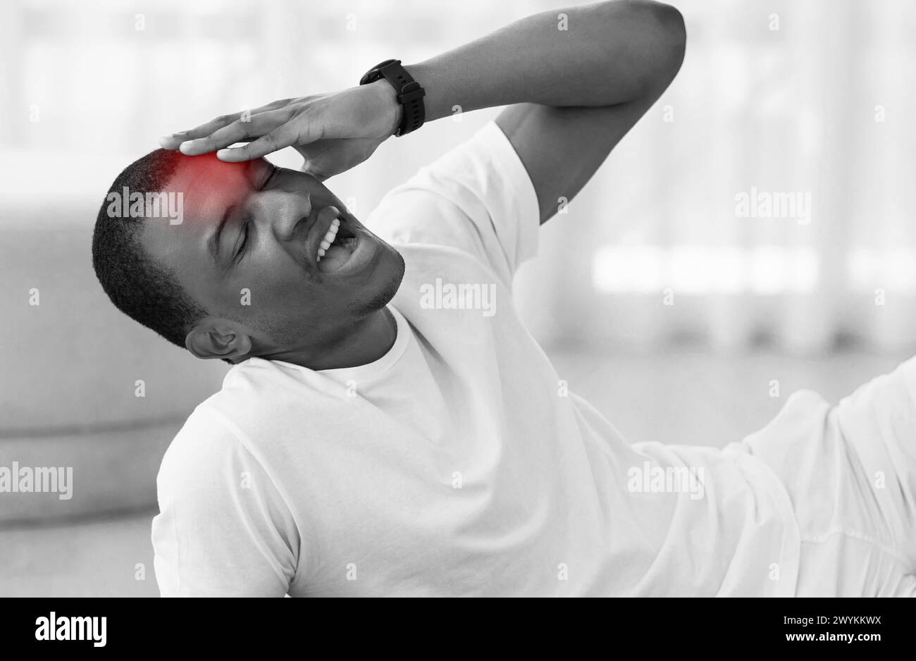 Man stretching back muscles at home grayscale Stock Photo - Alamy
