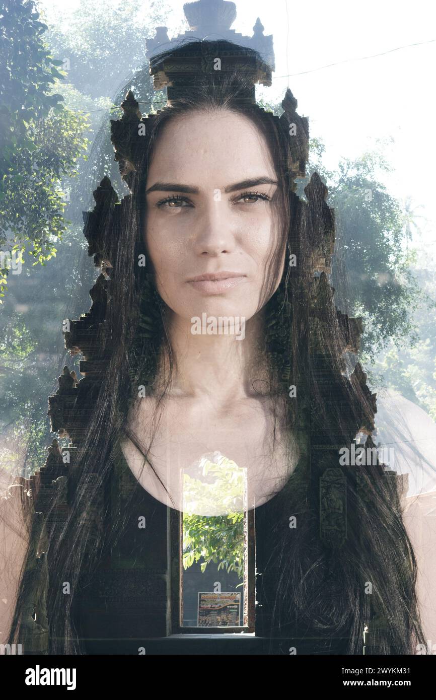 A woman's portrait merged with a Bali temple scene in a double exposure ...