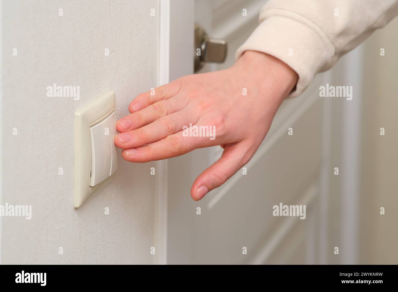 Womans hand light switch hi-res stock photography and images - Alamy
