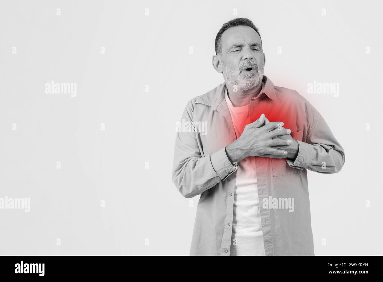 Man experiencing chest pain, black and white photo Stock Photo - Alamy