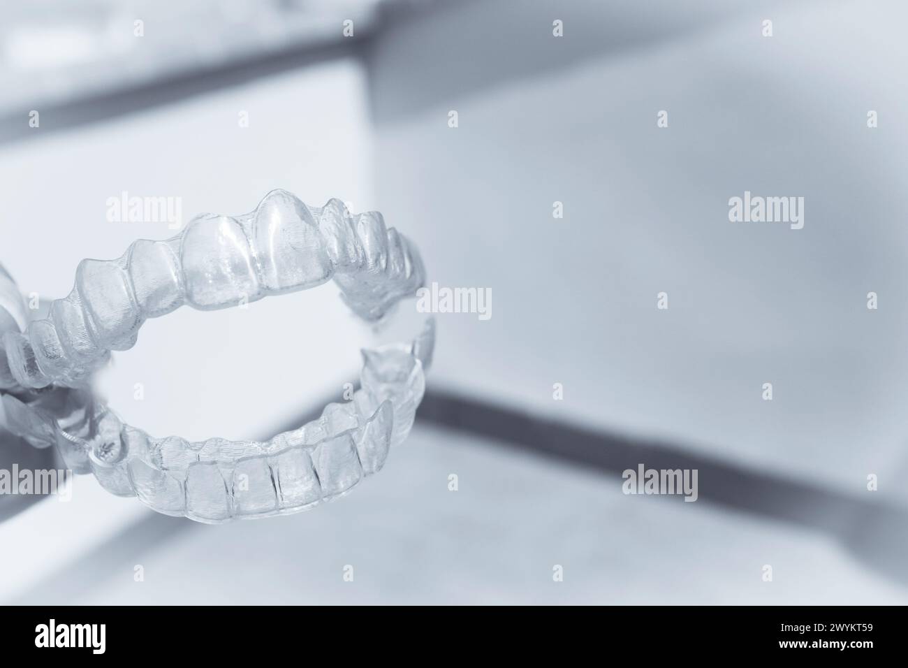 Invisible teeth aligner on light background. No people Stock Photo - Alamy