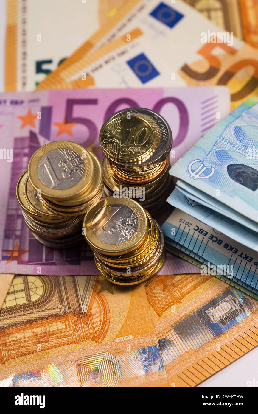 Stacked euro coins and banknotes close up photo with normal depth of ...