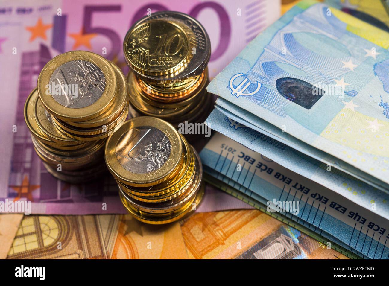 Stacked euro coins and banknotes close up photo with normal depth of ...