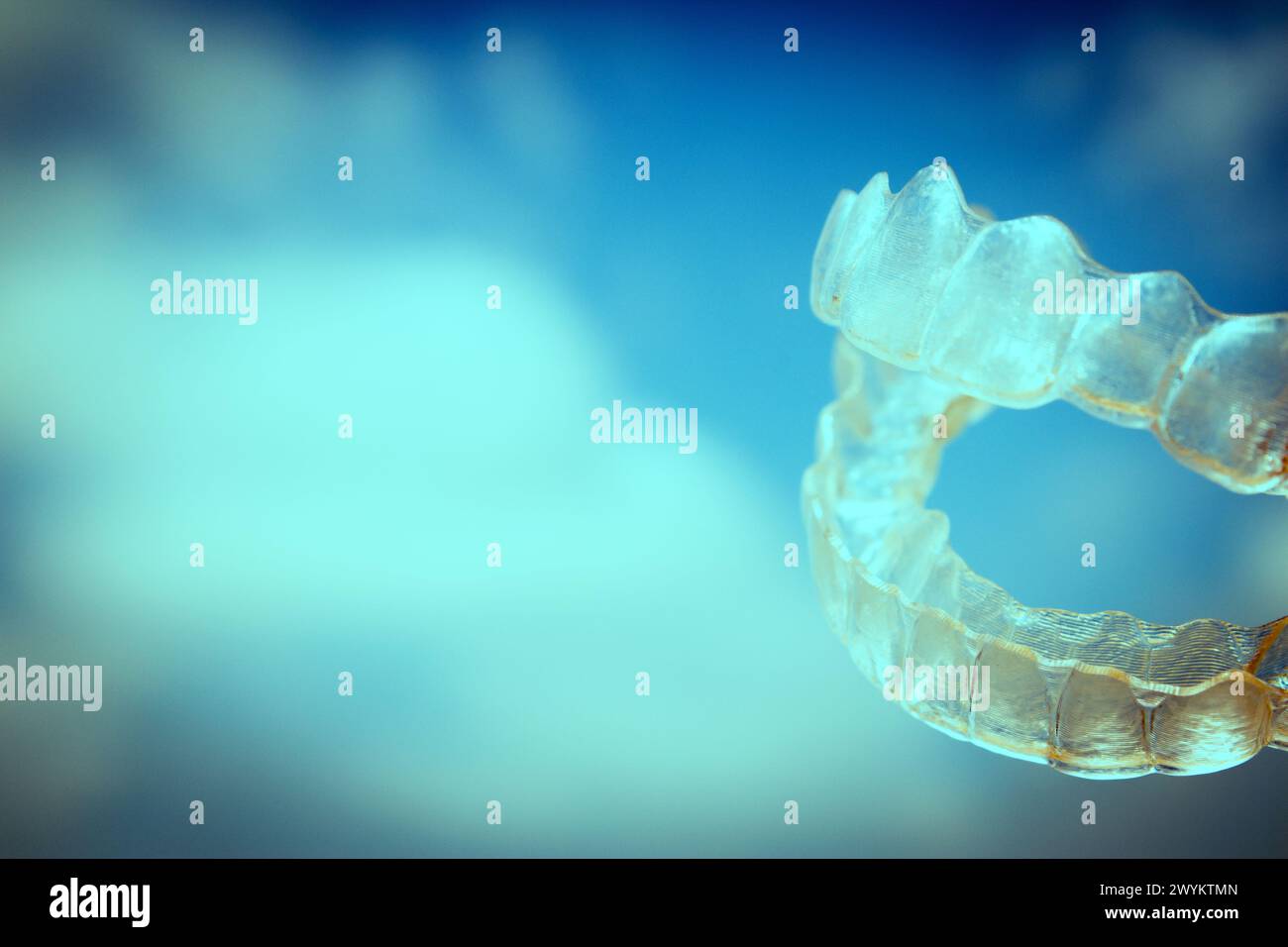 Invisible teeth aligner on light background. No people Stock Photo - Alamy