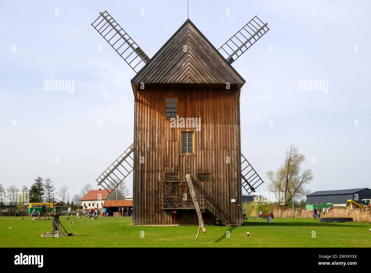 Mokry Dwor, Poland - April 7, 2024: Traditional wooden paltrak windmill in Mokry Dwor village ...
