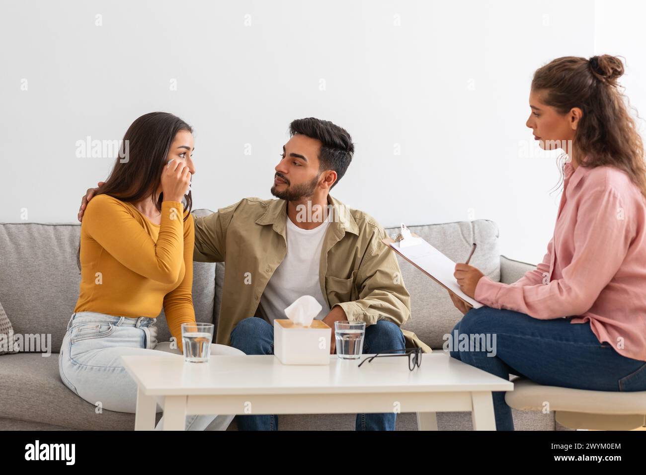 Couple at therapy session with counselor at clinic Stock Photo - Alamy