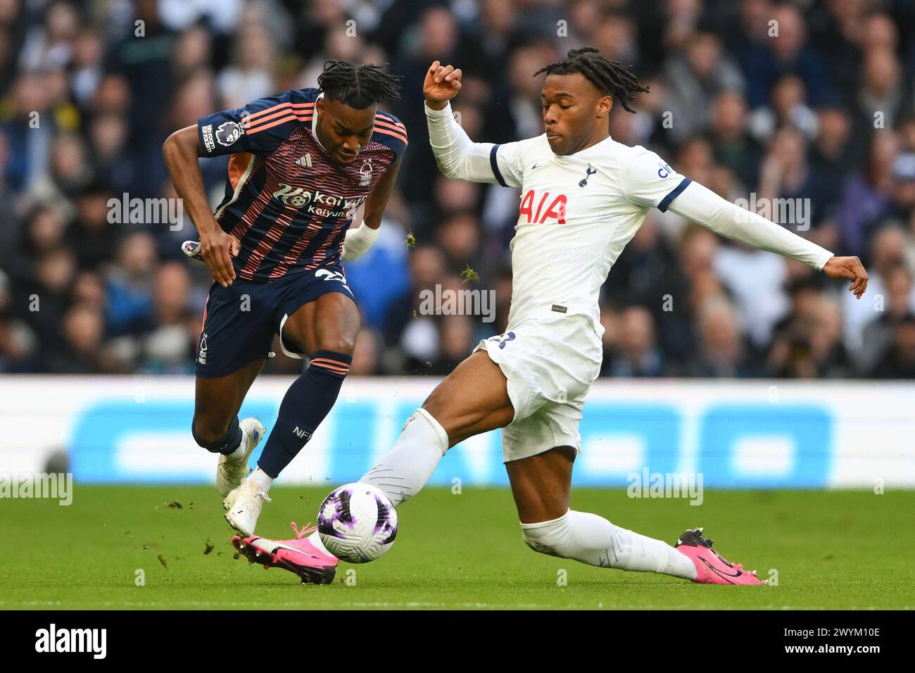 Destiny Udogie of Tottenham Hotspur tackles Anthony Elanga of ...