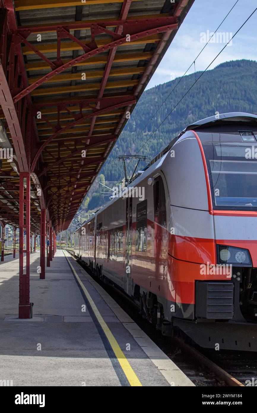 Passenger trains awaiting departure on a railway platform Stock Photo ...