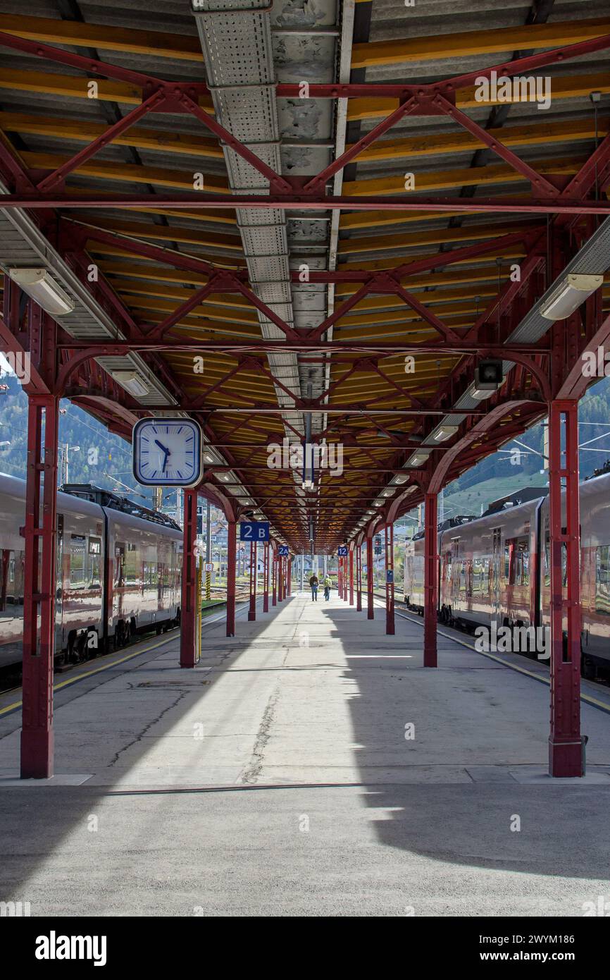 Passenger trains awaiting departure on a railway platform Stock Photo ...
