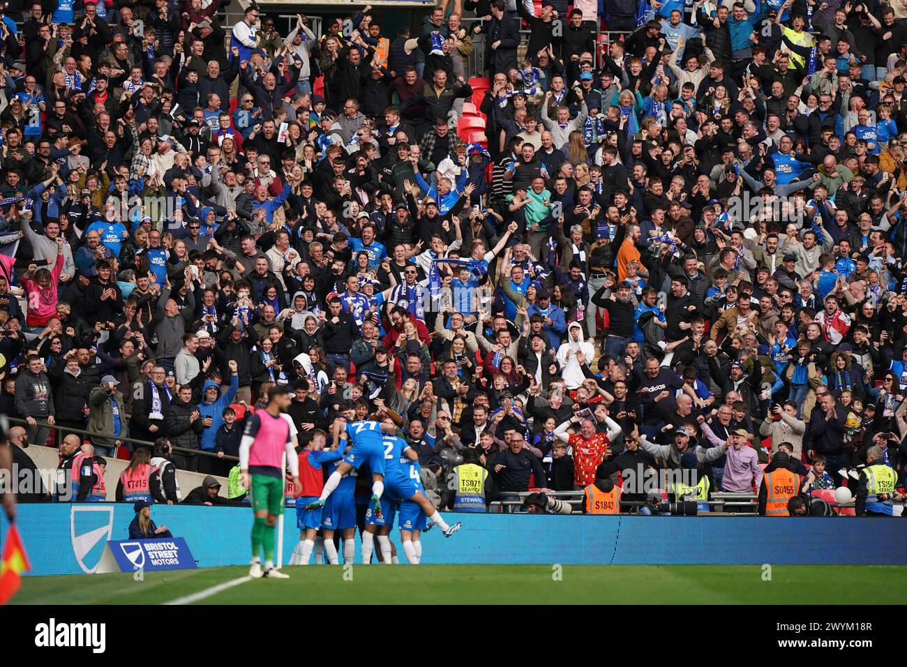 Peterborough United celebrate Peterborough United's Harrison Burrows ...