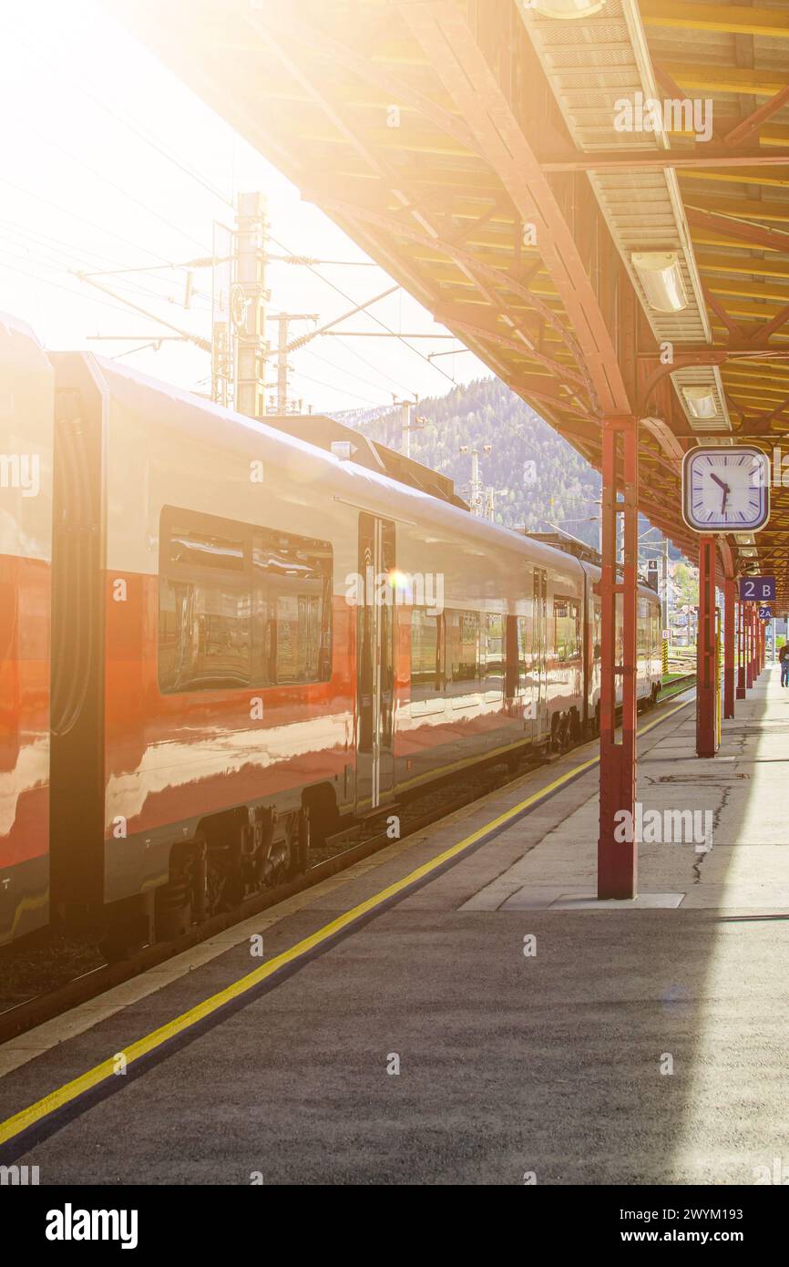 Passenger trains awaiting departure on a railway platform Stock Photo ...