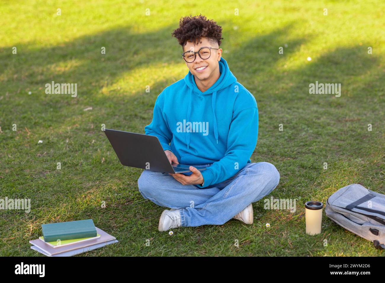 Outdoor study session with laptop, studying at park Stock Photo - Alamy