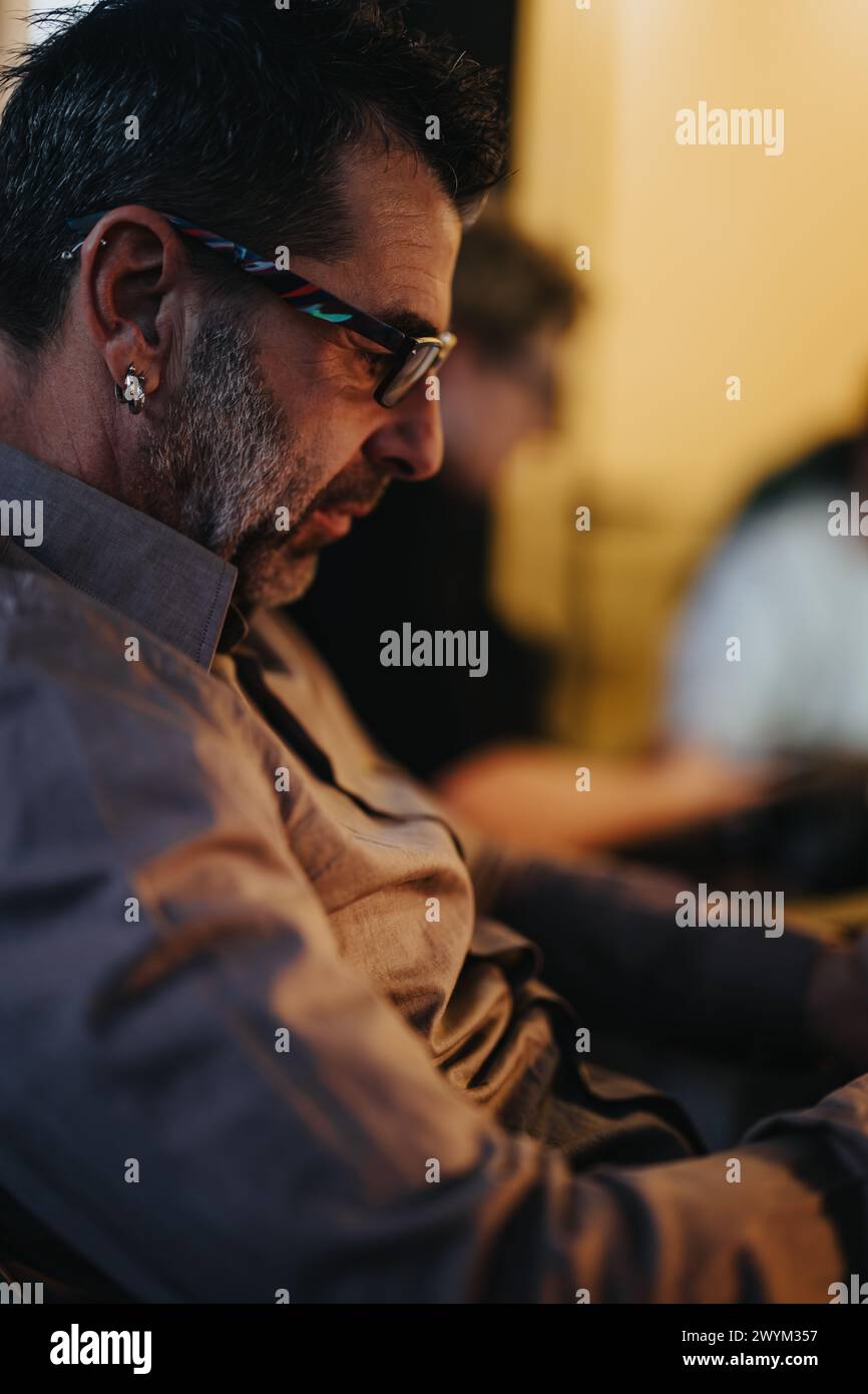 Multi generational team of business people collaborating and ...