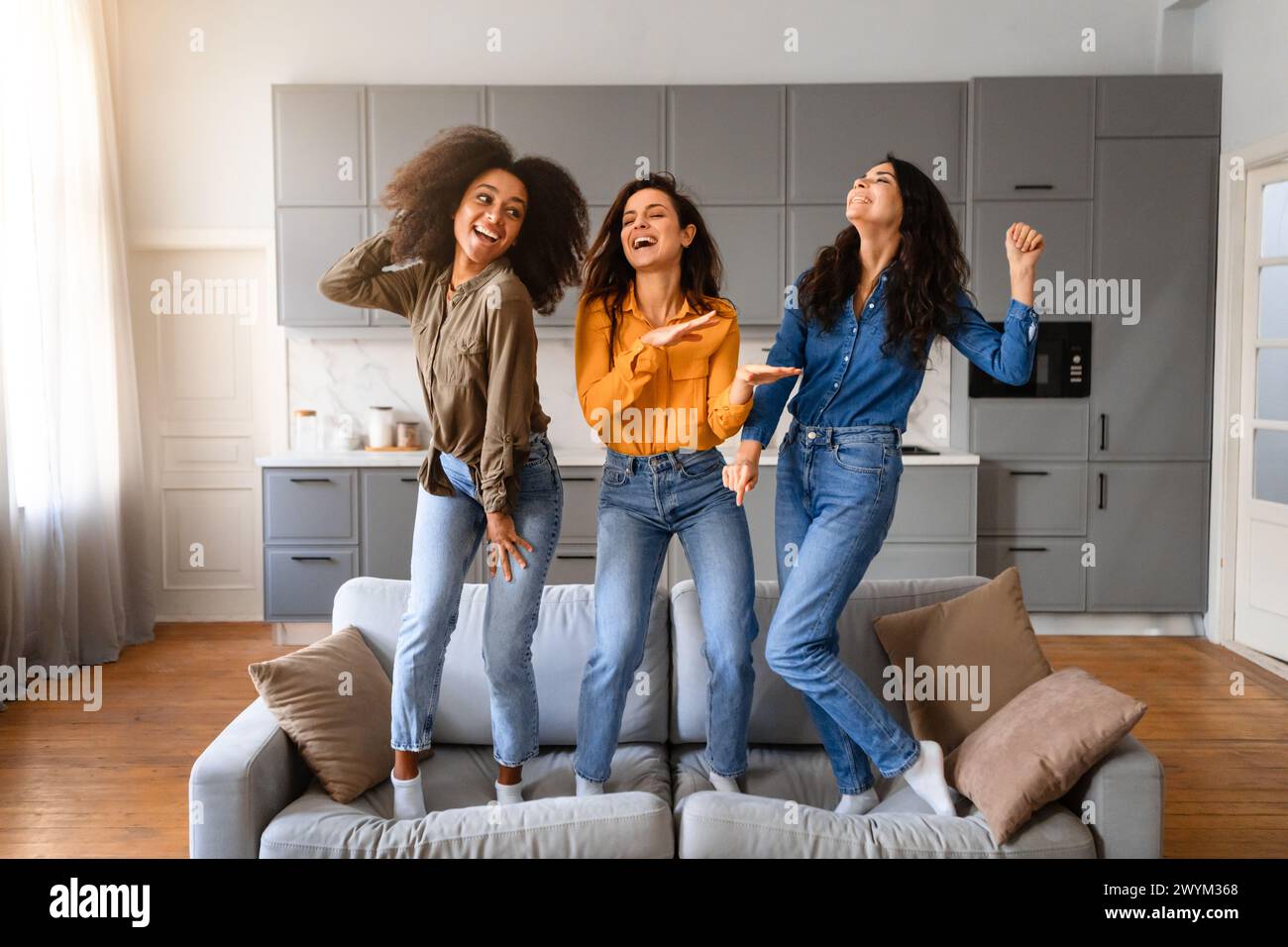 Women friends dancing joyfully home hi-res stock photography and images ...