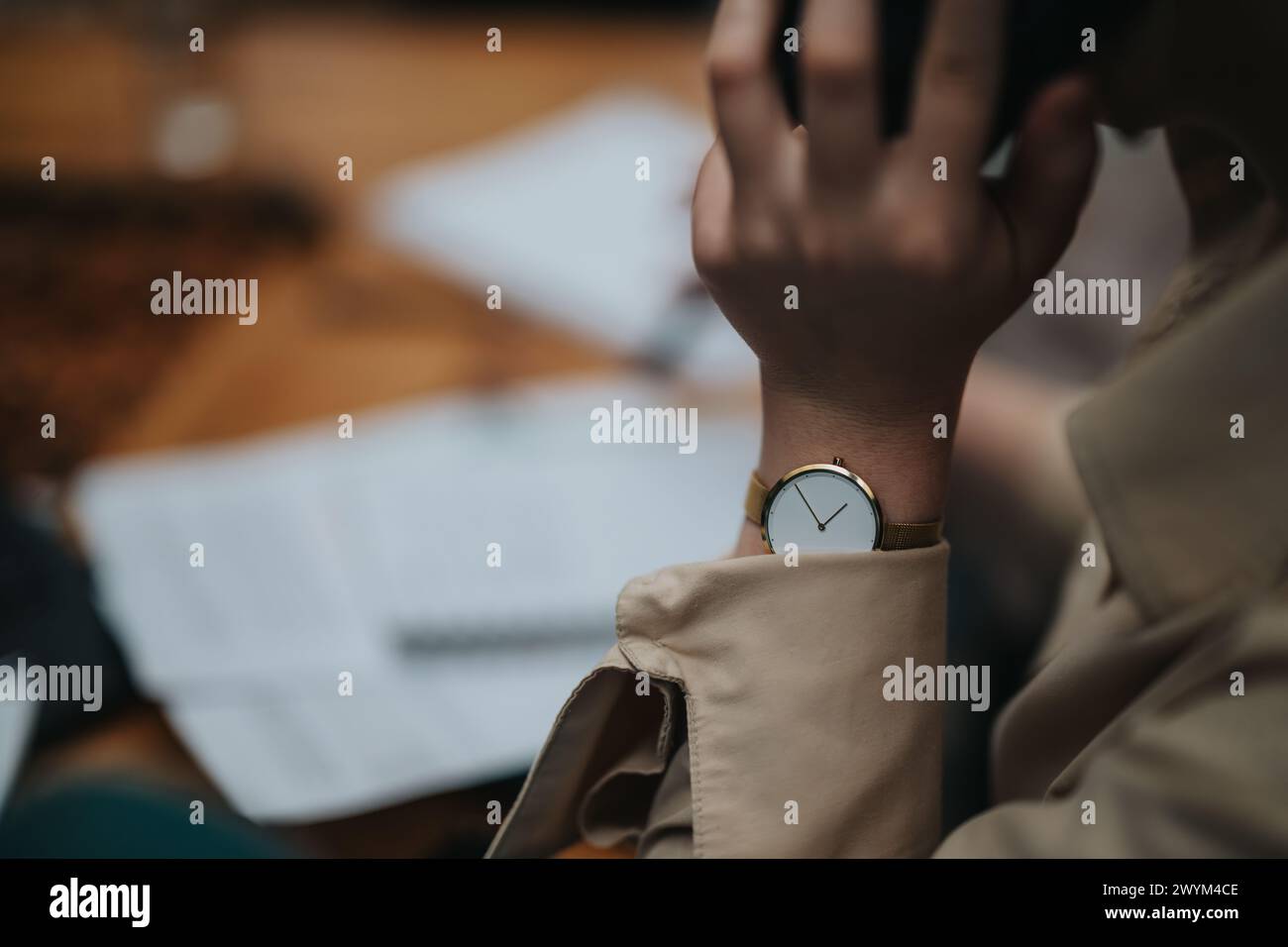 Professional business person checking the time on a wristwatch Stock ...