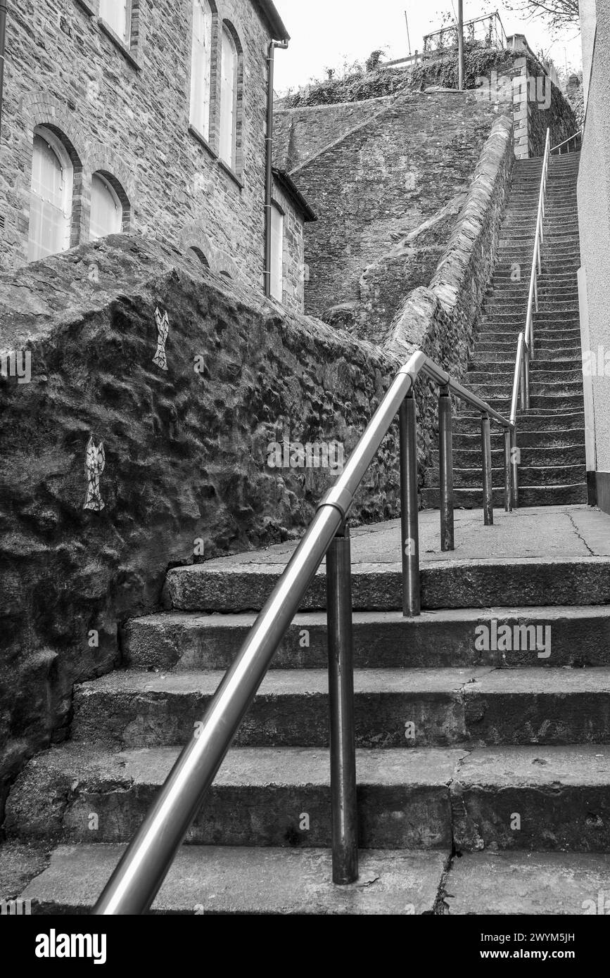 Black and white image of very old flight of steep, worn stone steps in ...