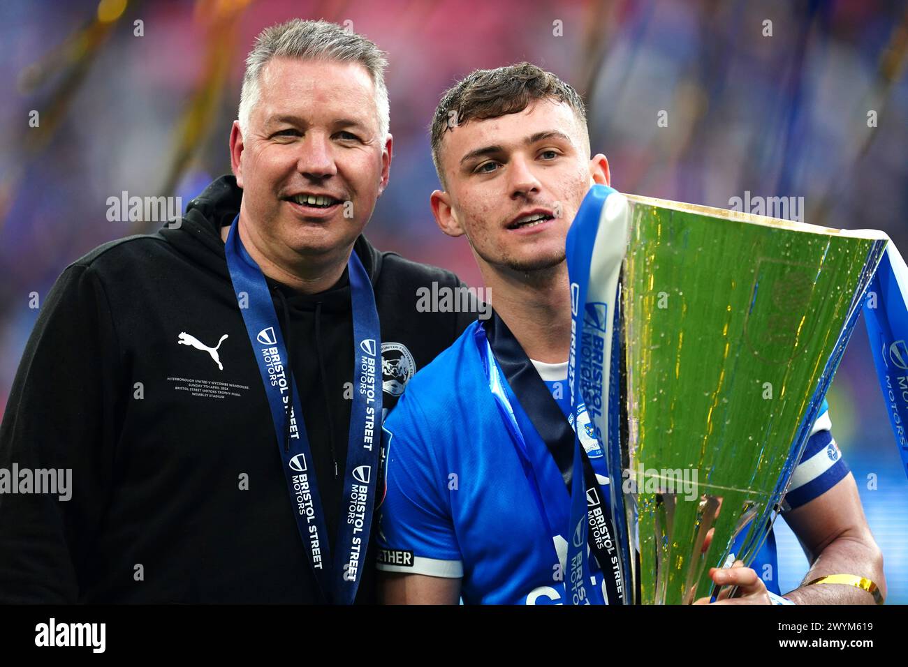 Peterborough United's Harrison Burrows (right) and manager Darren ...