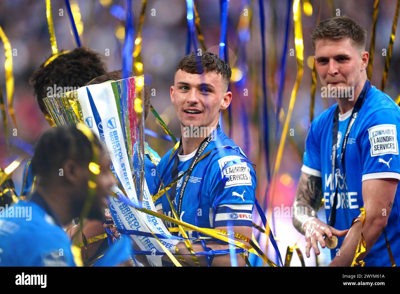 Peterborough United's Harrison Burrows with the EFL Trophy after ...