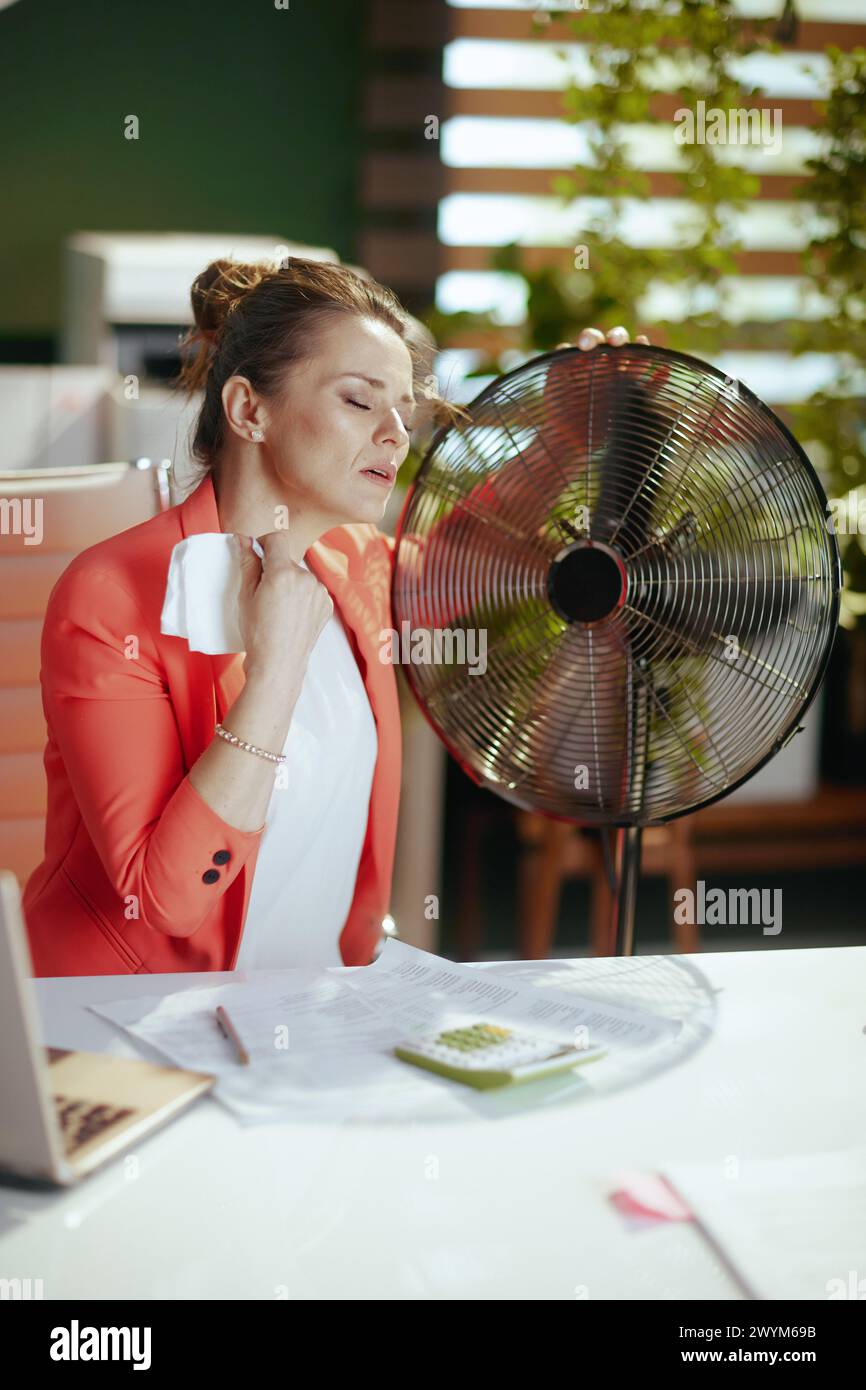 Sustainable workplace. modern small business owner woman at work in red ...