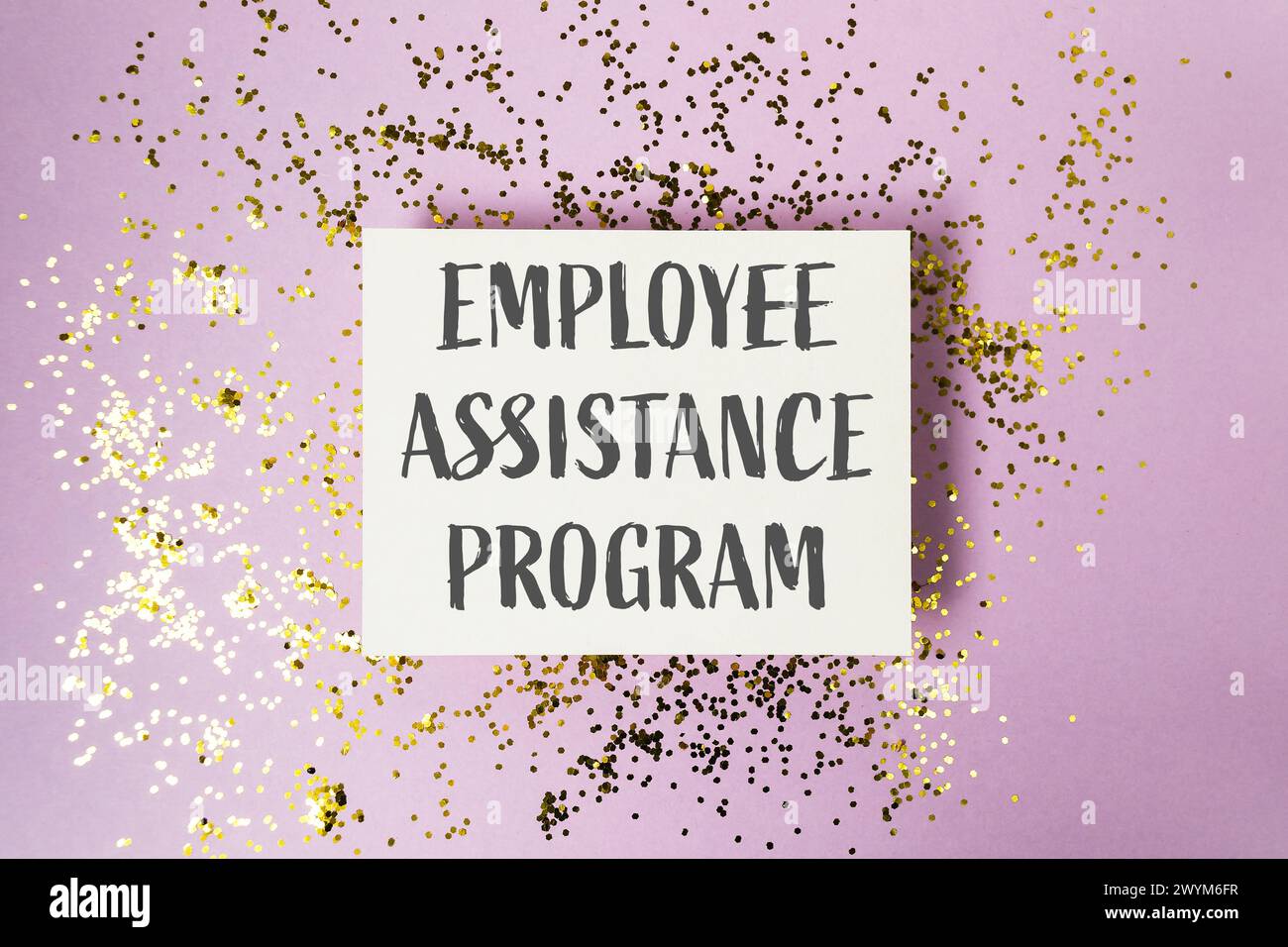 A white sign with gold glitter on it that says Employee Assistance ...