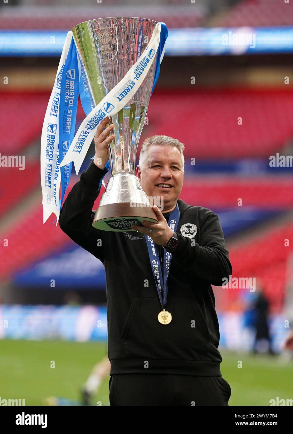 Peterborough United manager Darren Ferguson celebrates with the trophy ...