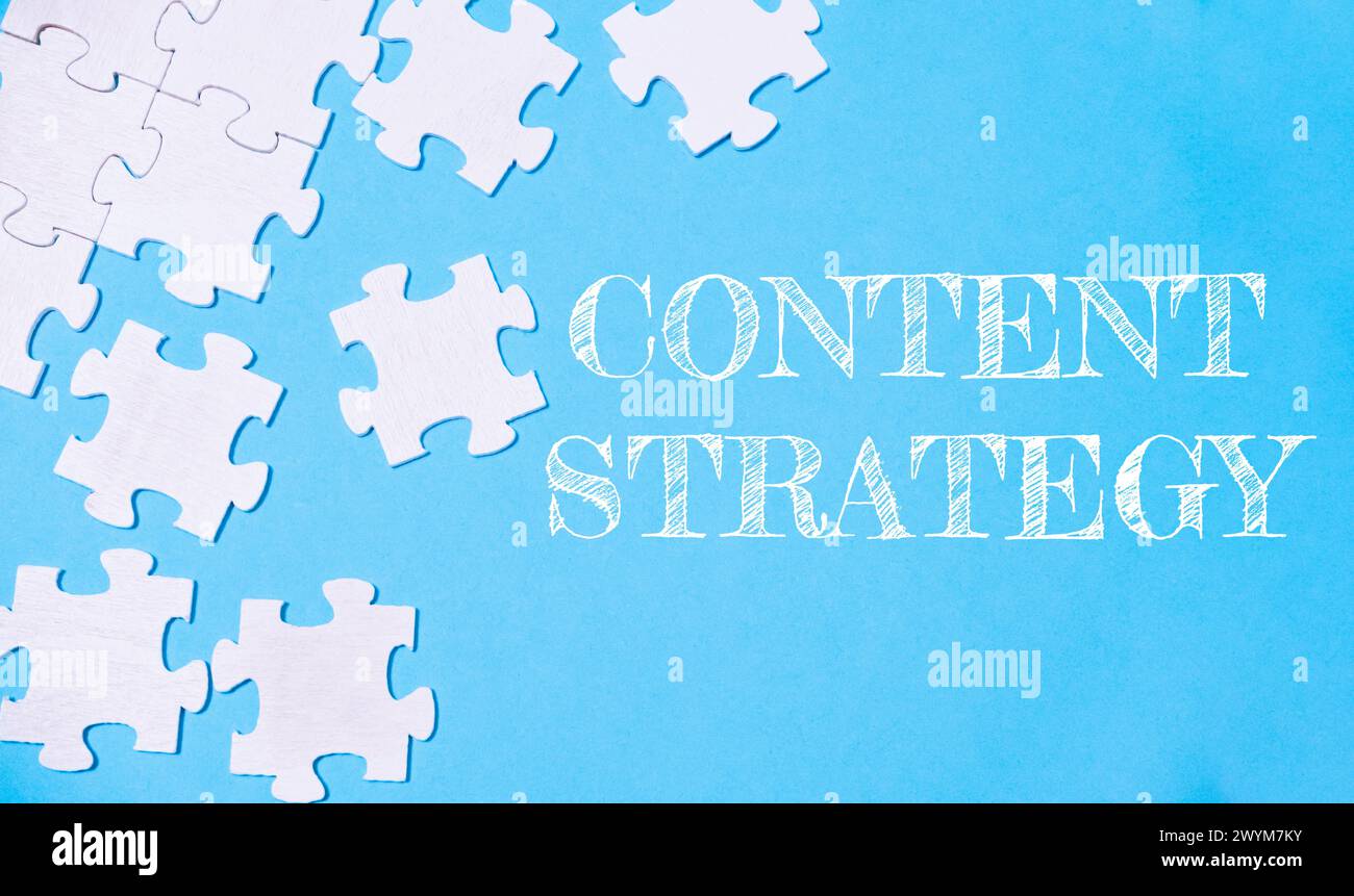 A jigsaw puzzle with the word content strategy written on it. The ...