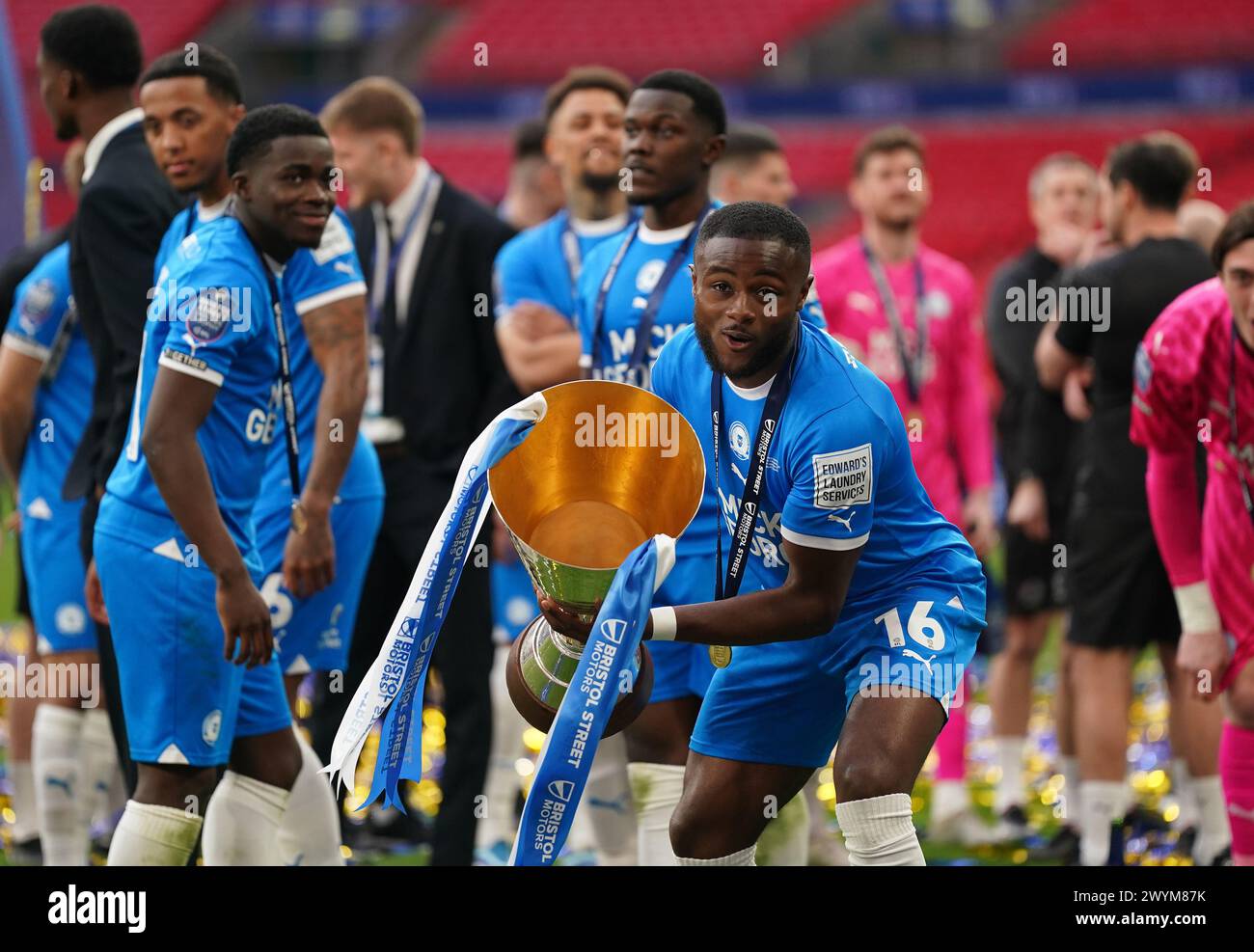 Peterborough United's David Ajiboye celebrates with the trophy after ...