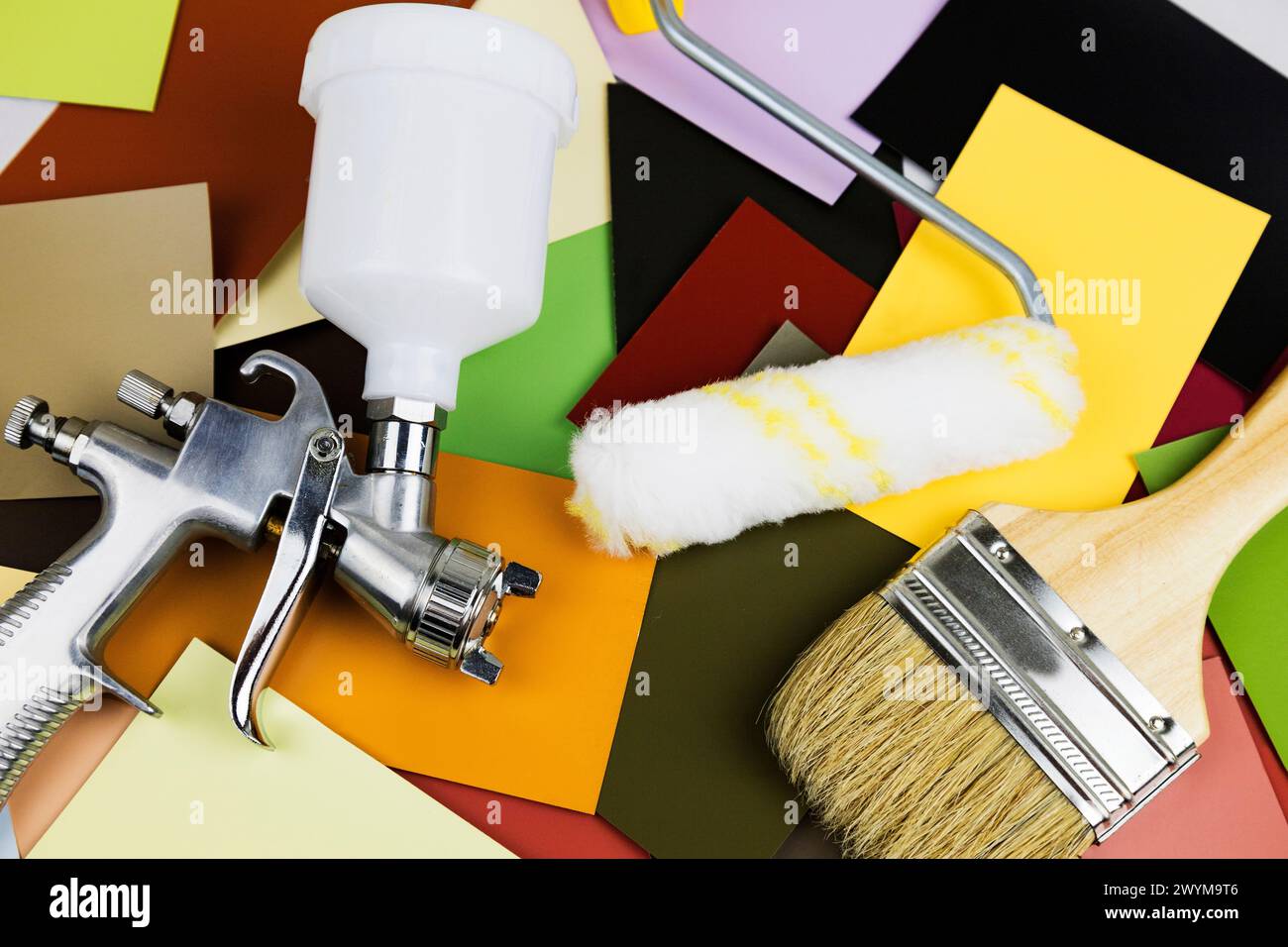 Paint spray gun at work at the workplace in the workshop. Paint Brush ...